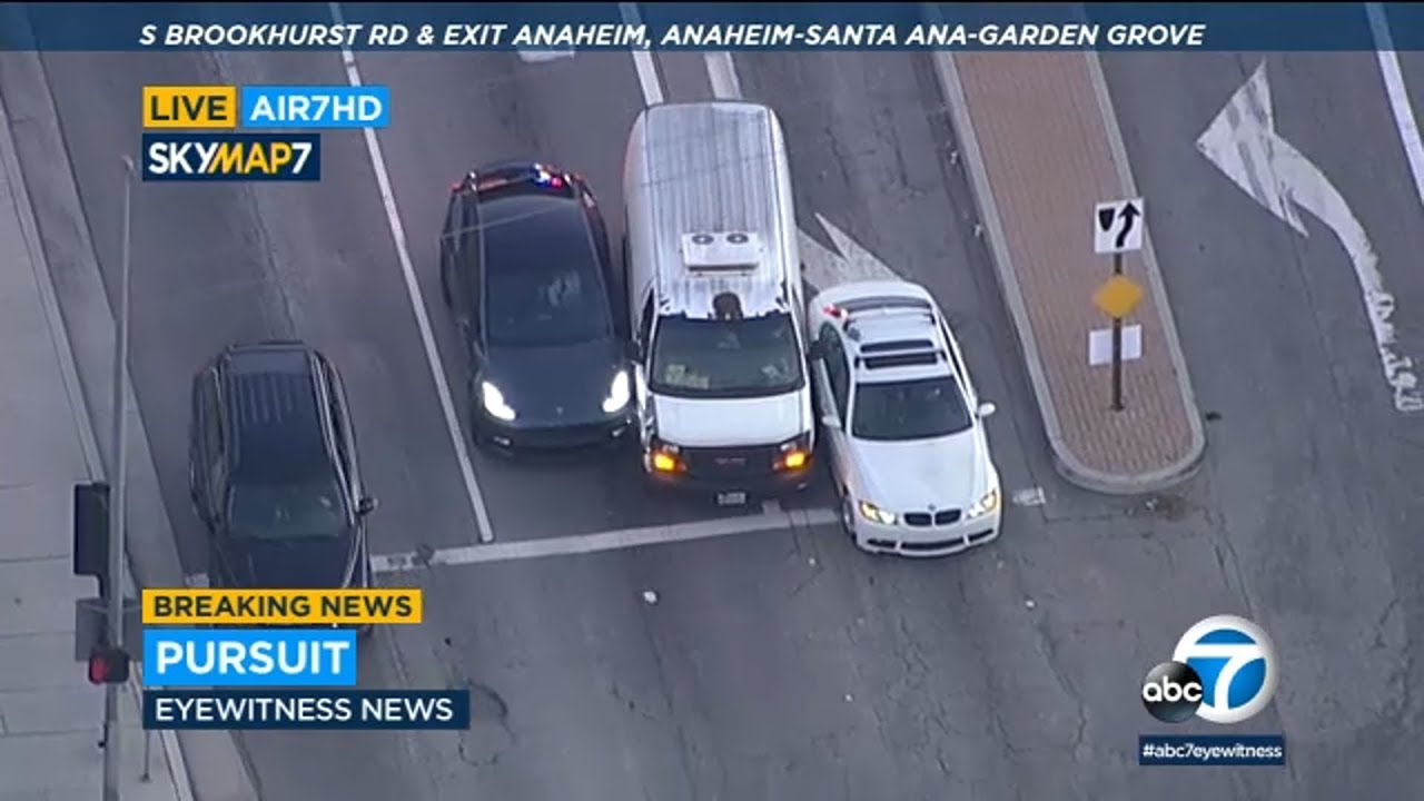 Suspect wedges stolen van between 2 cars to get through busy traffic ...