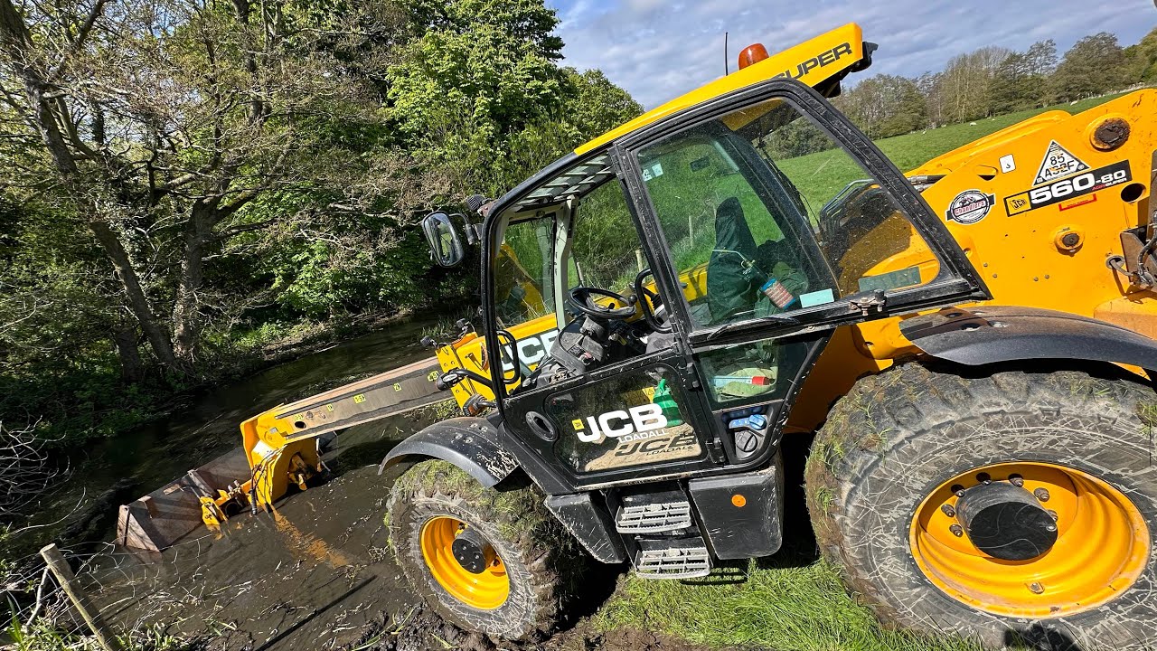 JCB goes swimming and a shed update - YouTube