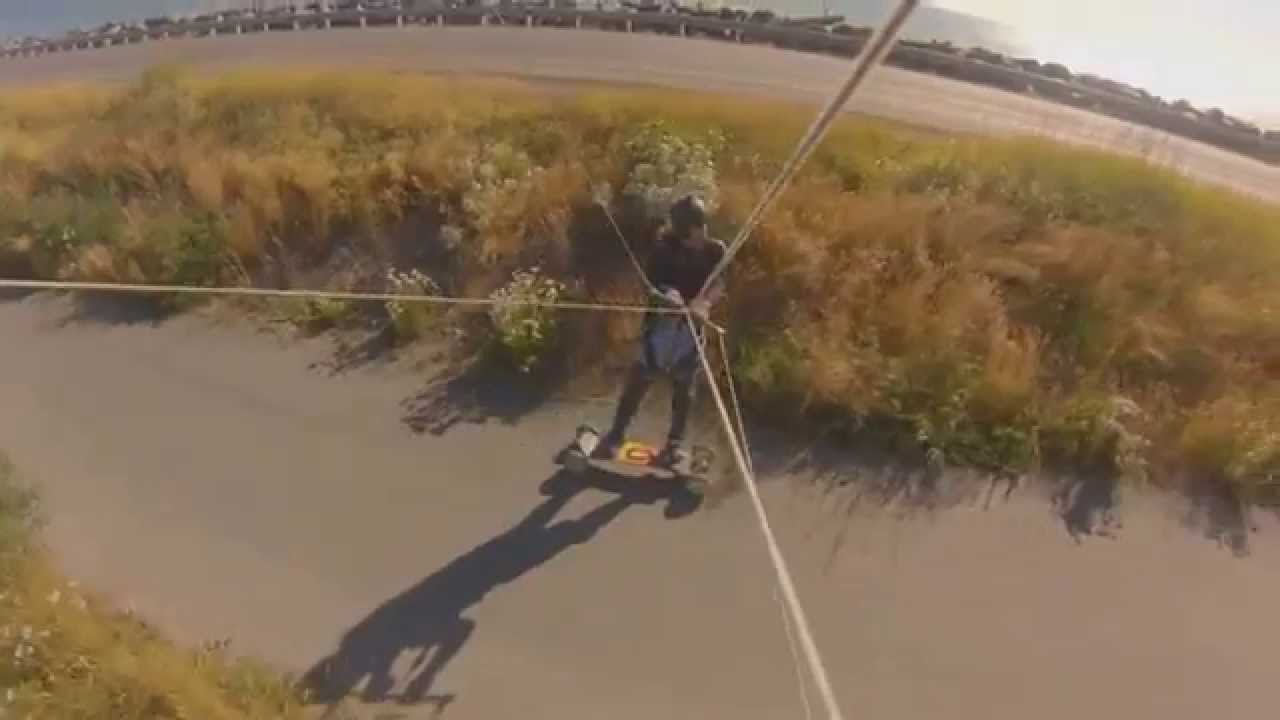 Kite Skateboarding on the Homer Spit bike trail - YouTube