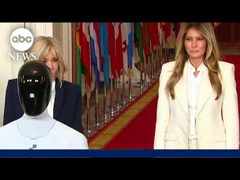 First lady Melania Trump walks with robot during White House technology summit