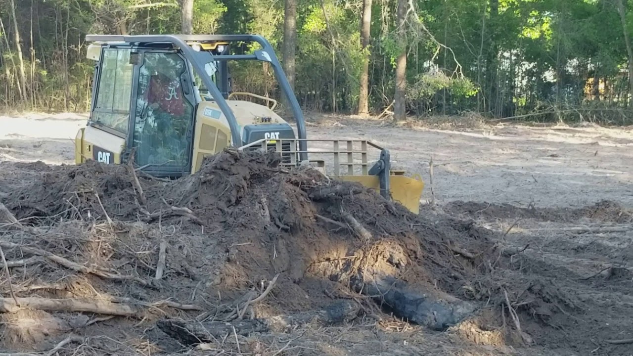 CAT D5K2 Root Raking - YouTube