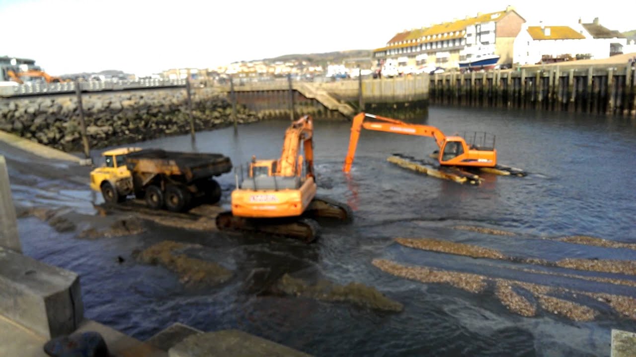 Dredging West Bay harbour - YouTube
