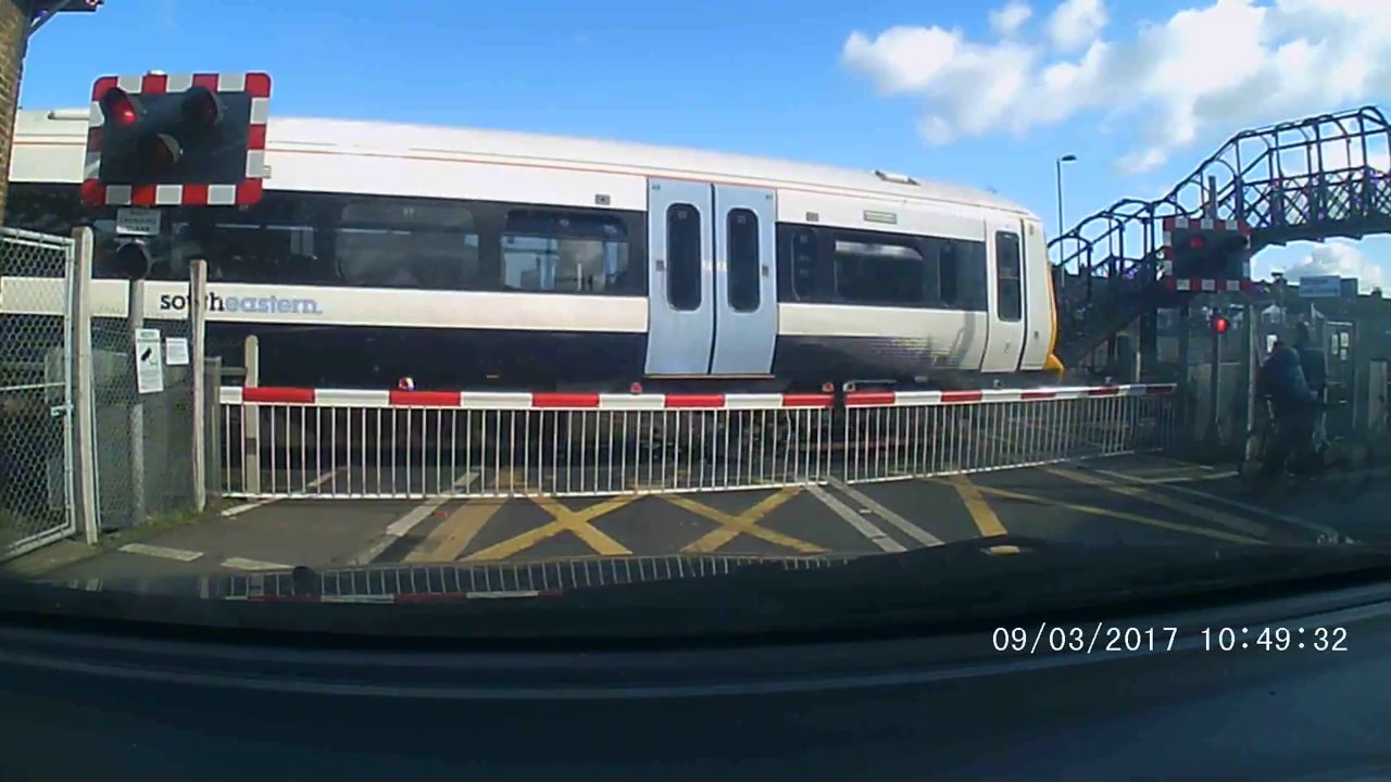 Gillingham level crossing, Javelin train and two other trains passing ...