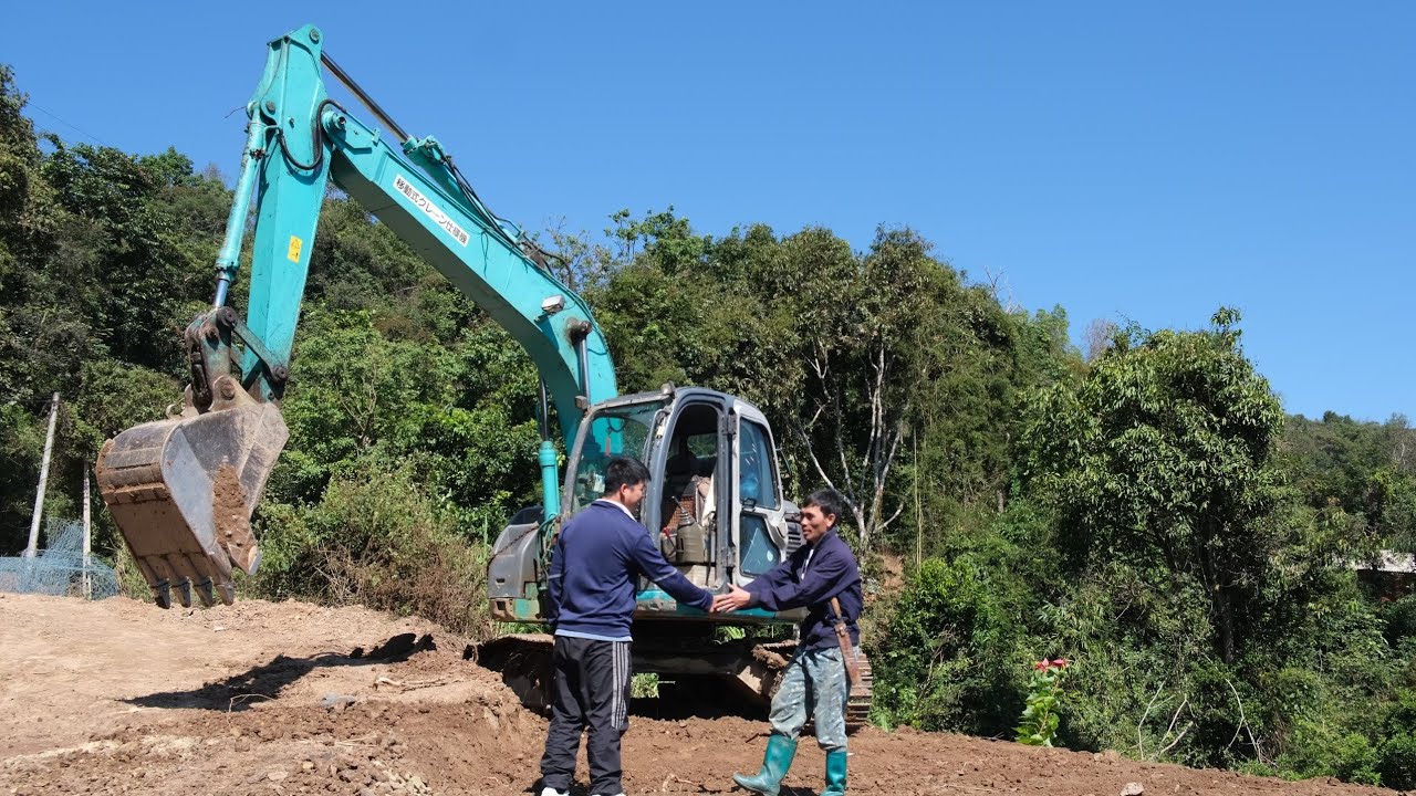 Hardworking Farmer Stacking Gabions - Excavator Leveling the Ground l ...