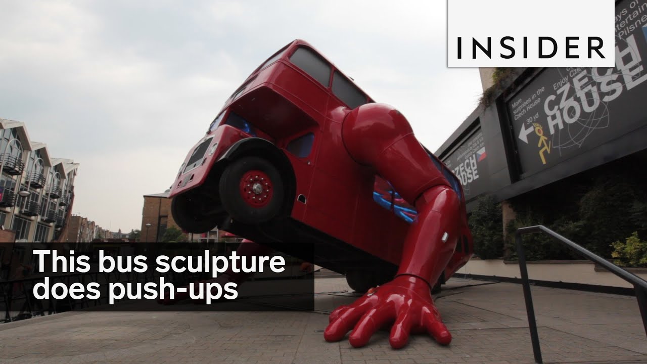 Giant Robot Bus Sculpture Does Push-Ups - YouTube