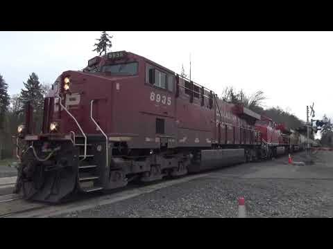 (Northbound) CP 8935 leads a Loaded Grain Train through the South 19TH Street Railroad Crossing ...