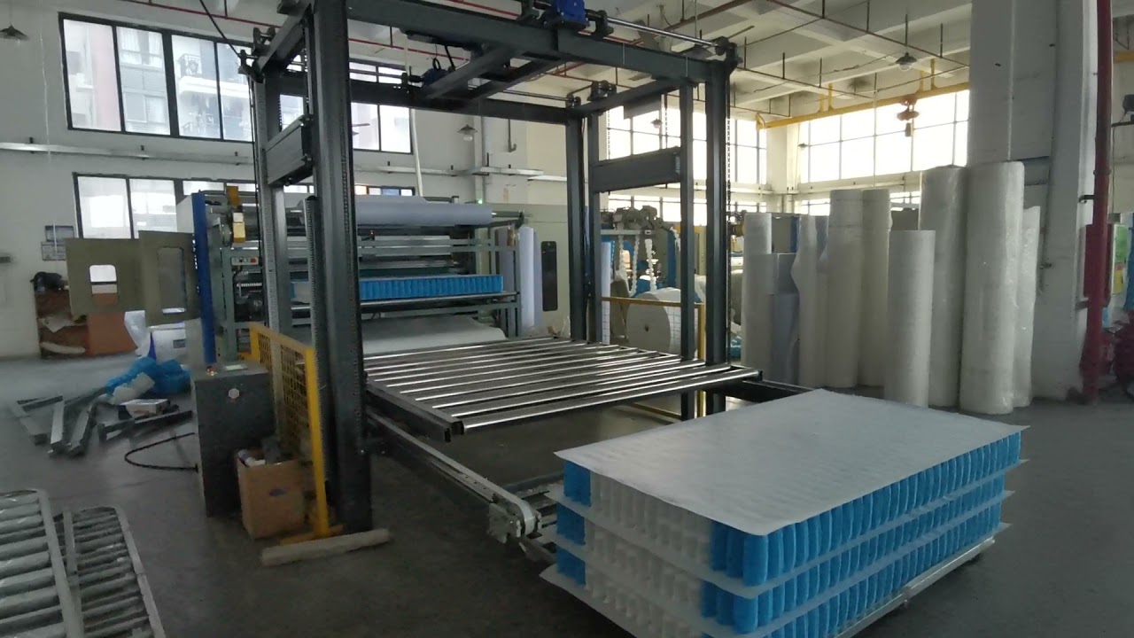 Mattress palletizing machinery stacking palletizing mattresses - YouTube