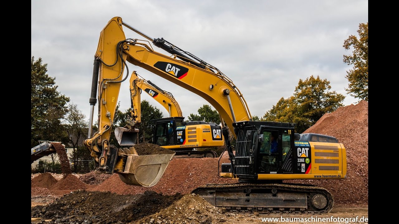 CAT 336 E mit OilQuick belädt Sattelzug - YouTube