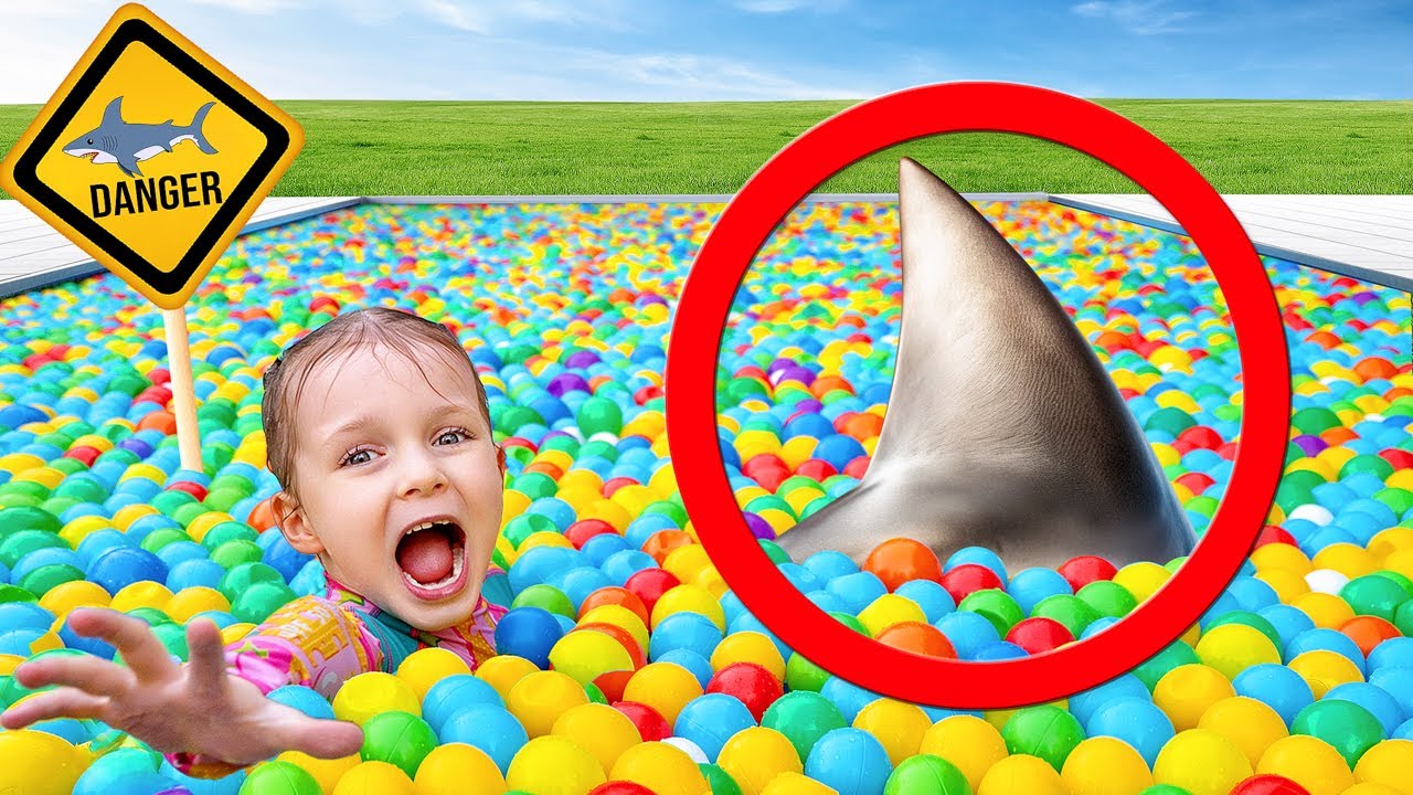 Funny video about shark in a swimming pool full of plastic balls - YouTube