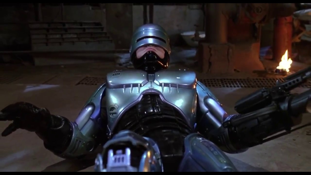 Robocop Murphy fights and shoots the bad guy dead at the moment of ...