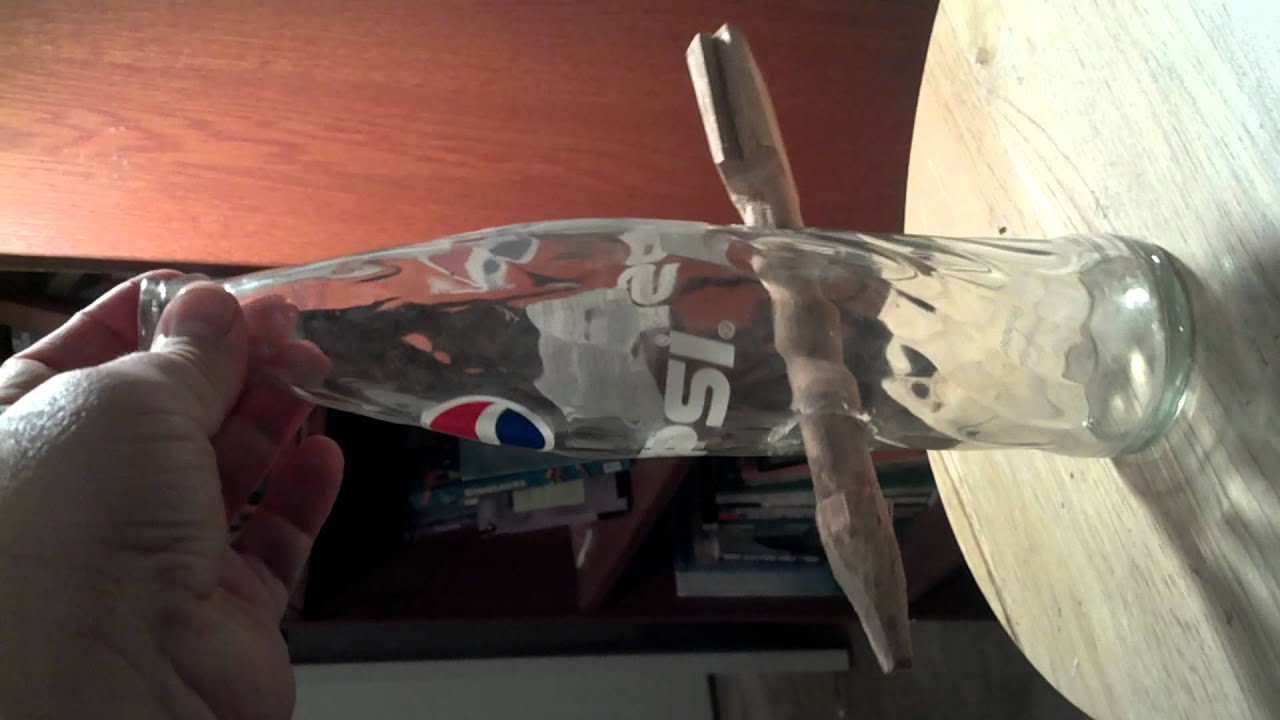 Solid wood arrow through a Pepsi bottle. - YouTube
