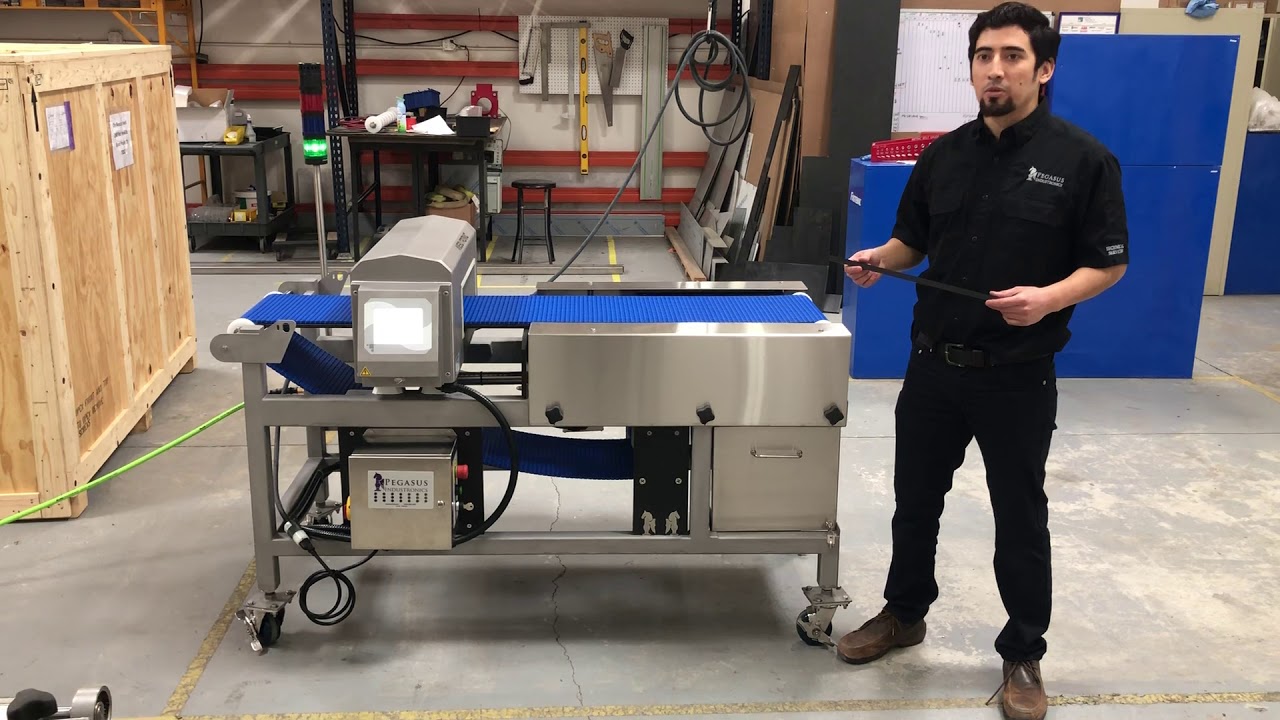 Pegasus retractable conveyor with metal detector - YouTube