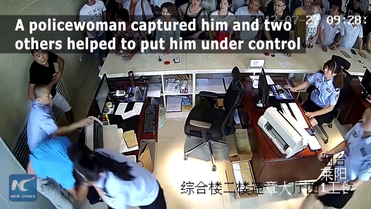 Robber visits police station, caught - YouTube