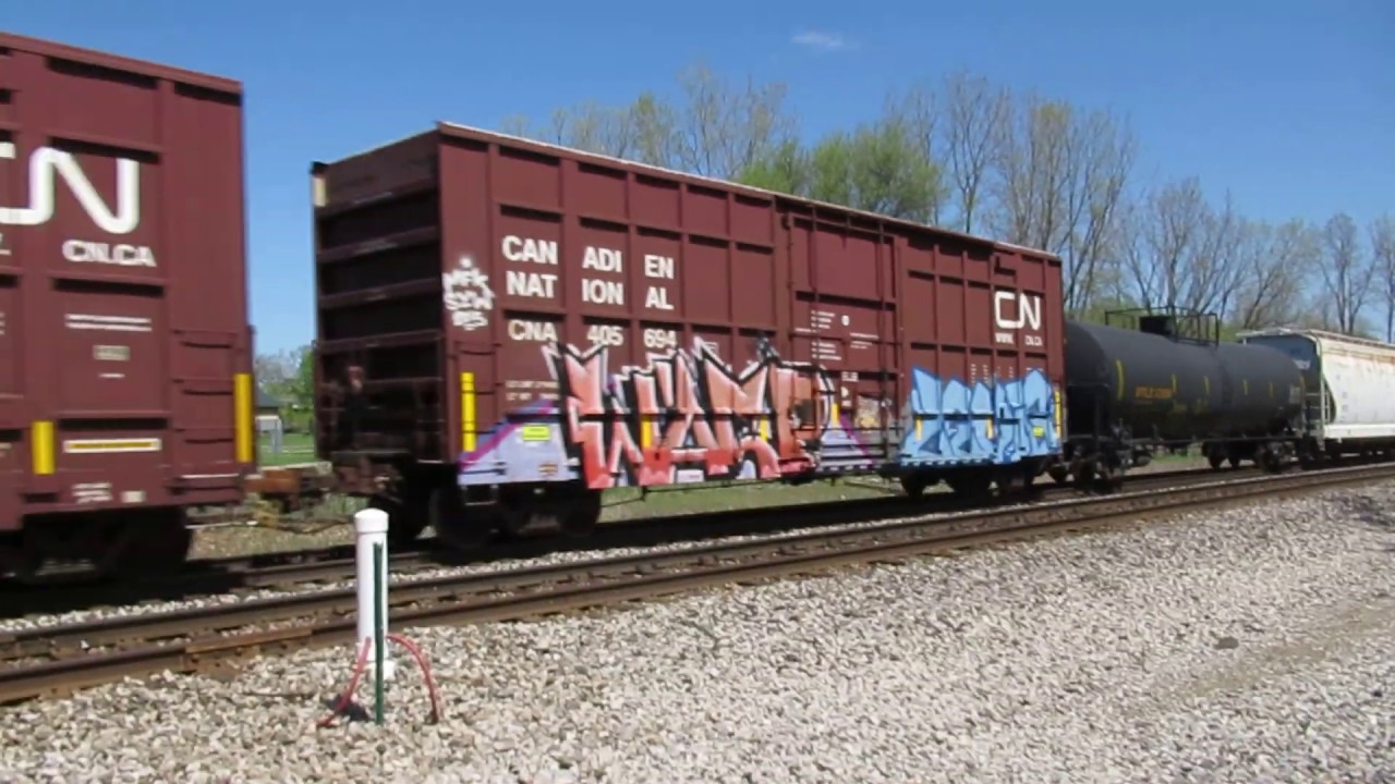 CN 2435, GECX(CSX) 7365 heading East with a mixed freight train: ATSF ...