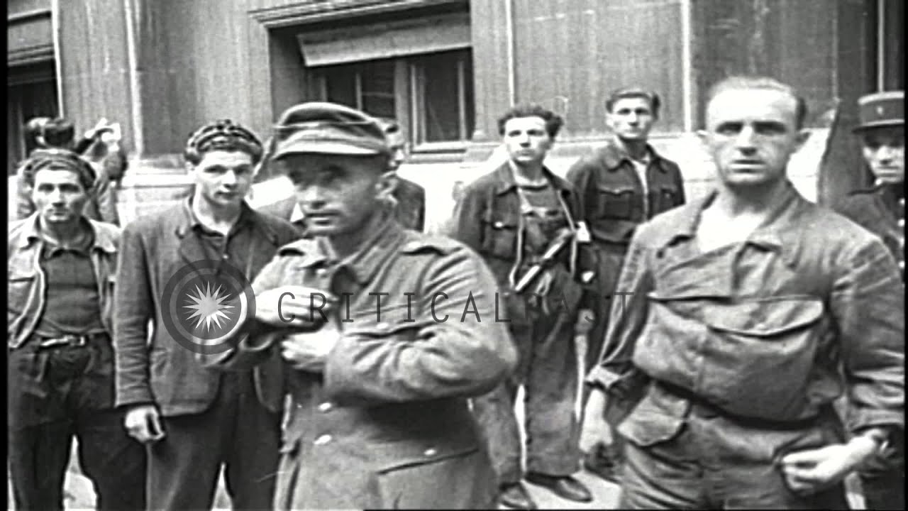 Formation of FFI (French Forces of the Interior) men outside a building ...