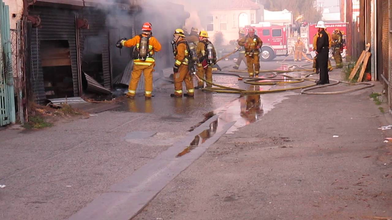 LAFD puts out garage fire in alley - YouTube
