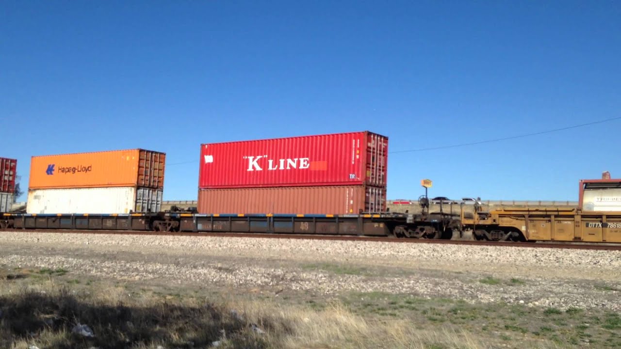 UP 7357 Leads Westbound Stack Train passes through Beaumont CA - YouTube
