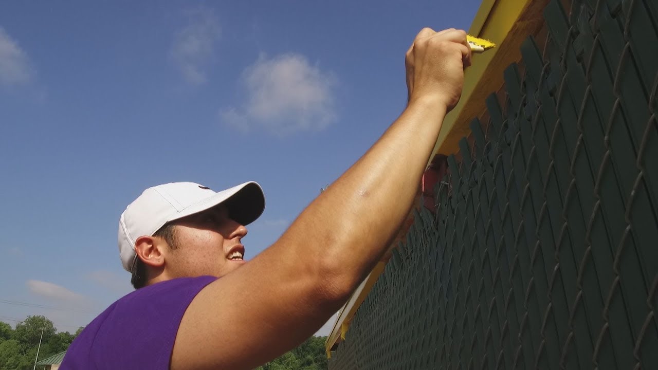 Volunteers Help Paint Baseball Field at Trinity View Park - YouTube