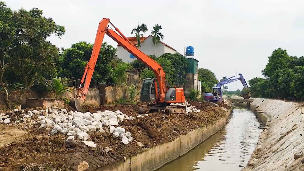 River embankment project, HITACHI excavator digs soil and rock - YouTube
