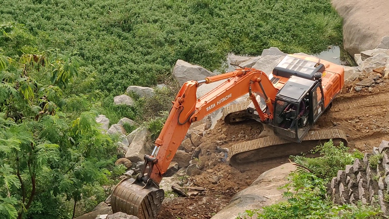 Incredible Excavator Lifting Heavy Stones near Lake- Working hard ...