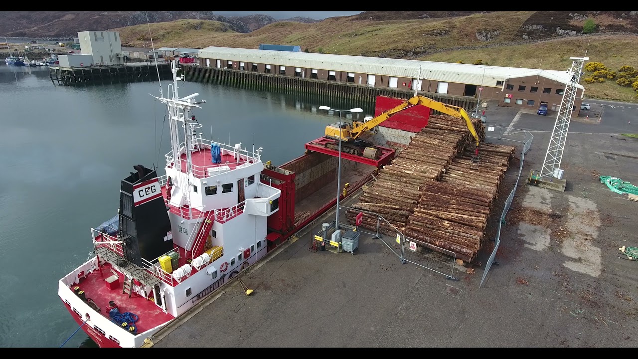 Cargo ship loading logs - YouTube