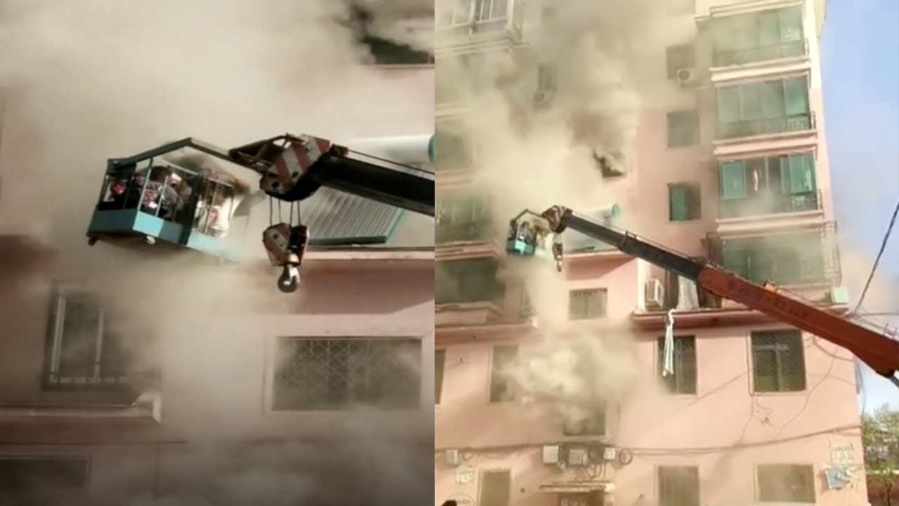 Man uses crane to save 14 people trapped in burning building - YouTube