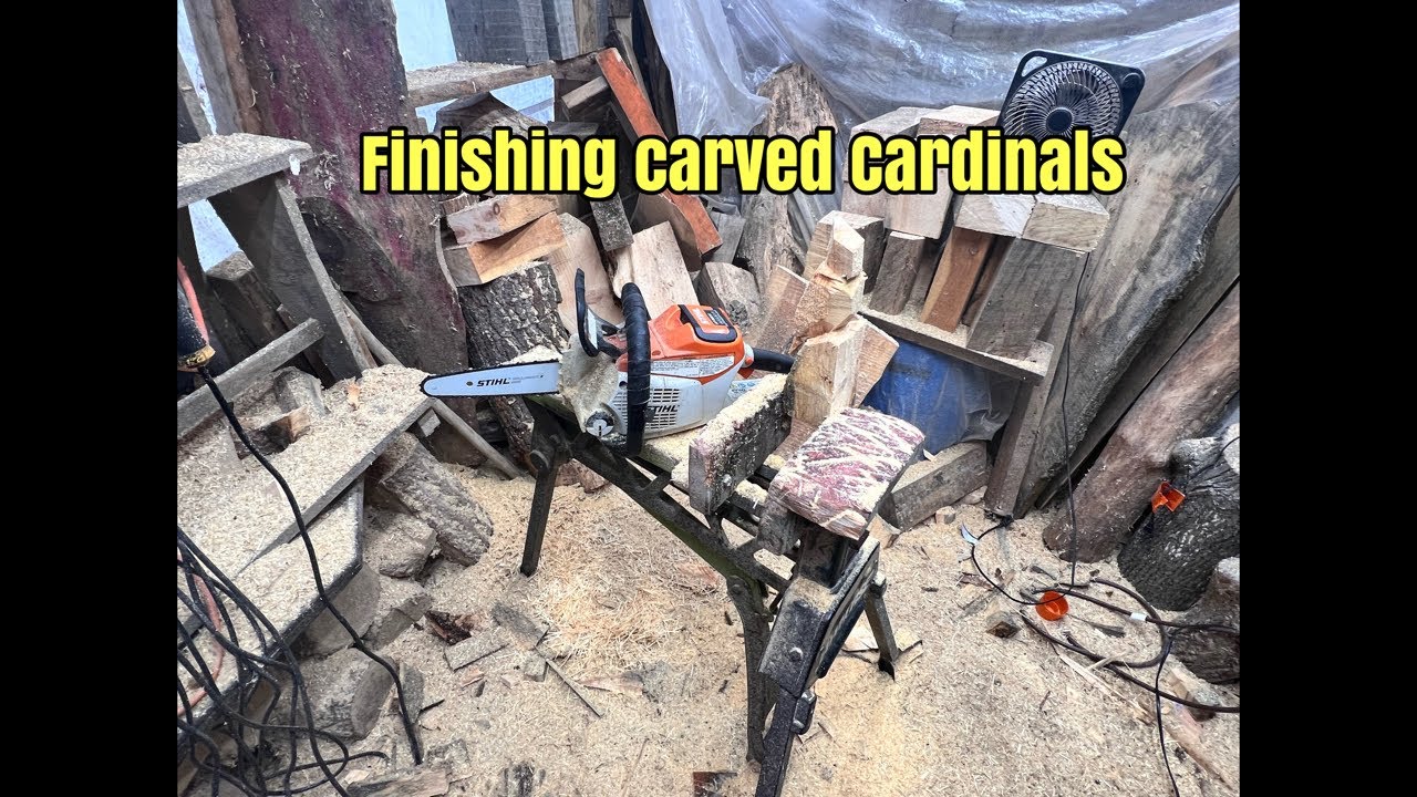 Finishing up a chainsaw carved cardinal Army - YouTube