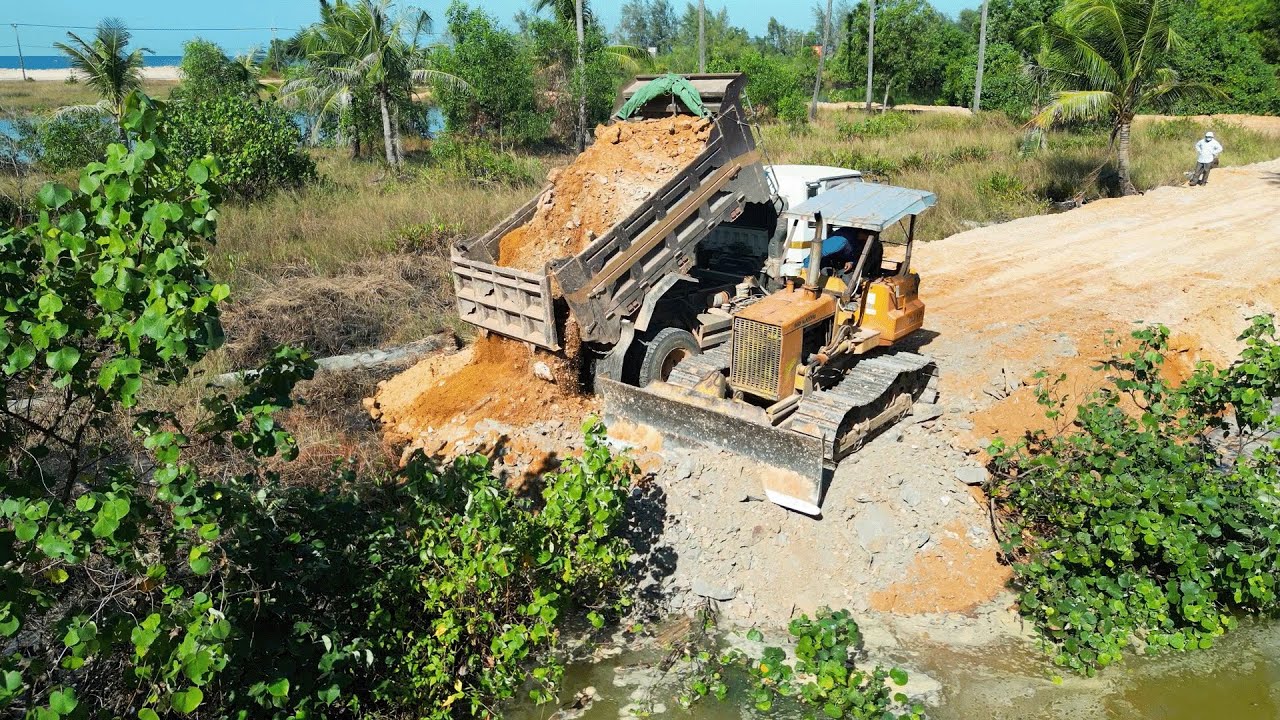 Powerful Road Construction by Bulldozer D31P and Fleet of 5T Trucks on ...