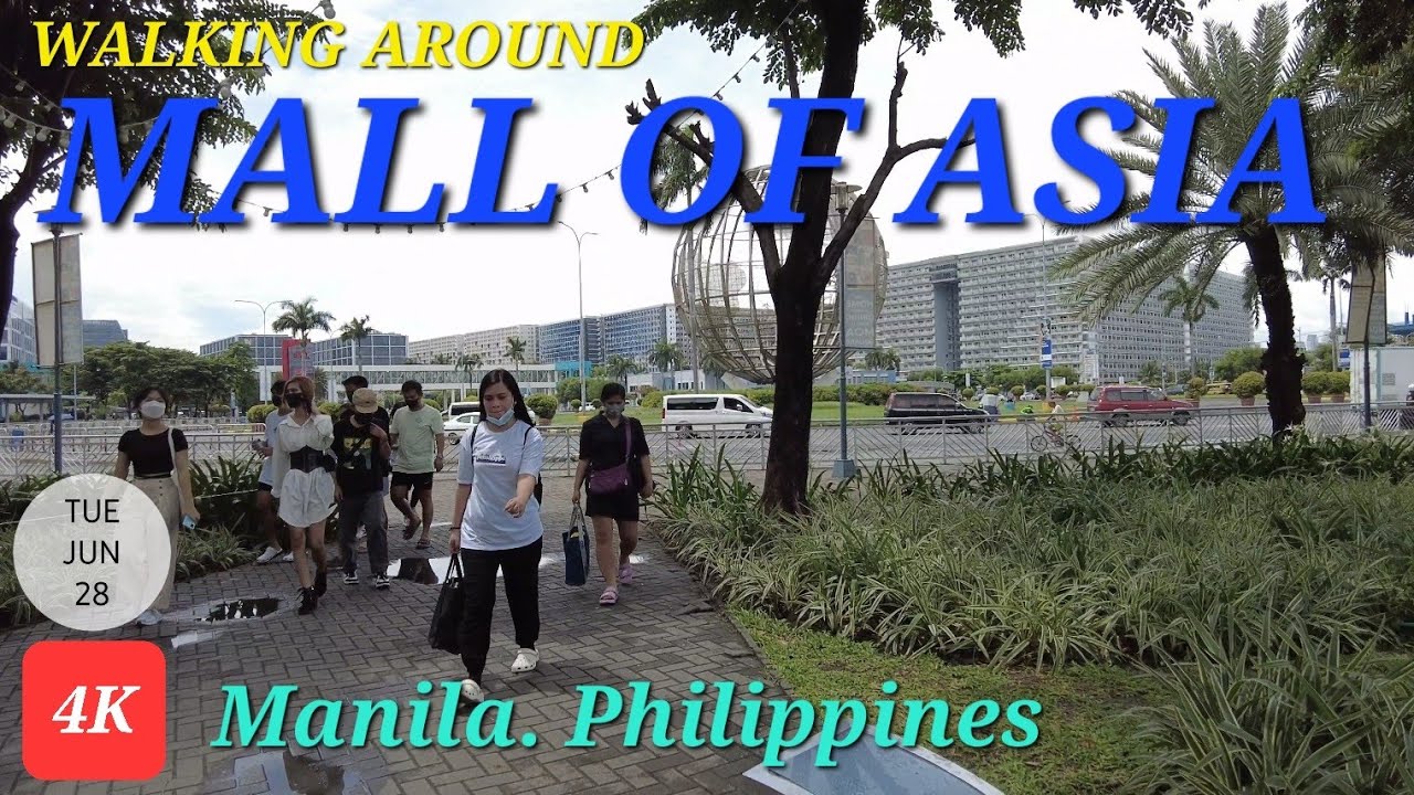 Walking around Mall of Asia during work time before heavy rain. Manila ...