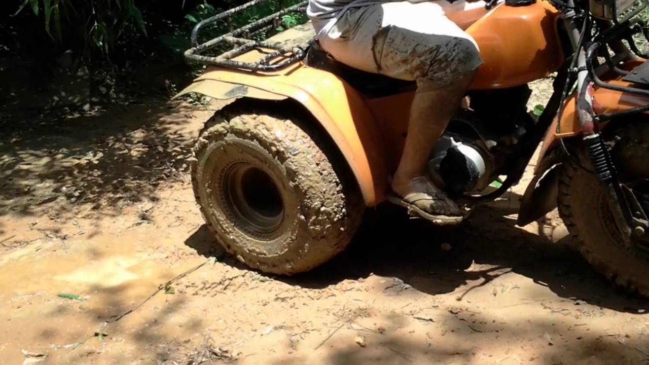 Three wheeler mudding - YouTube
