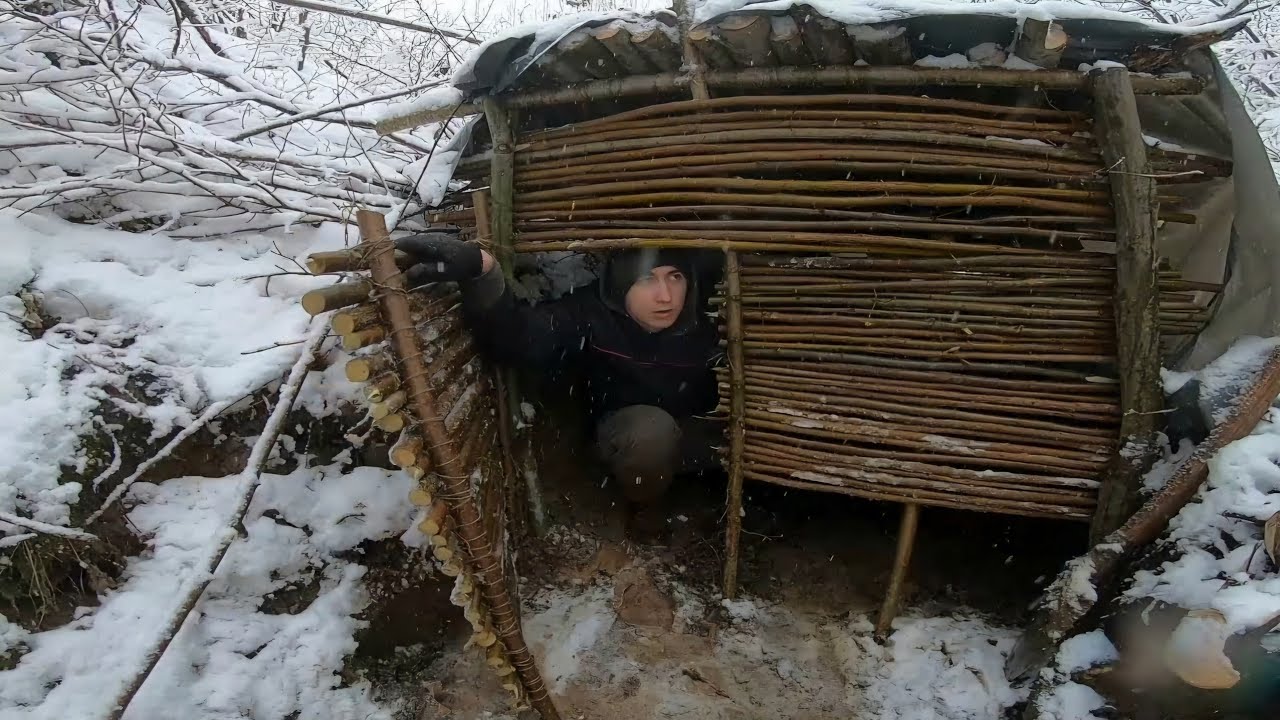 Building a shelter between two seasons. Snow and frost overnight ...