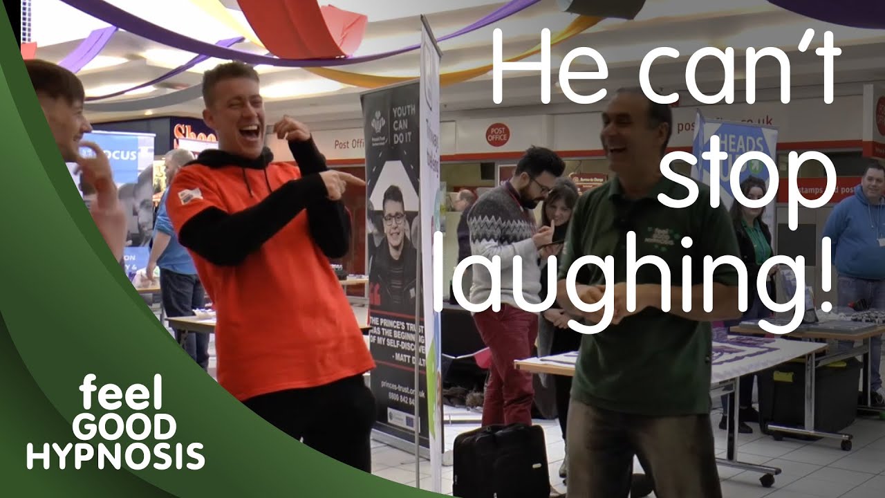Hypnotised guy can't stop laughing during street hypnosis skit as we ...