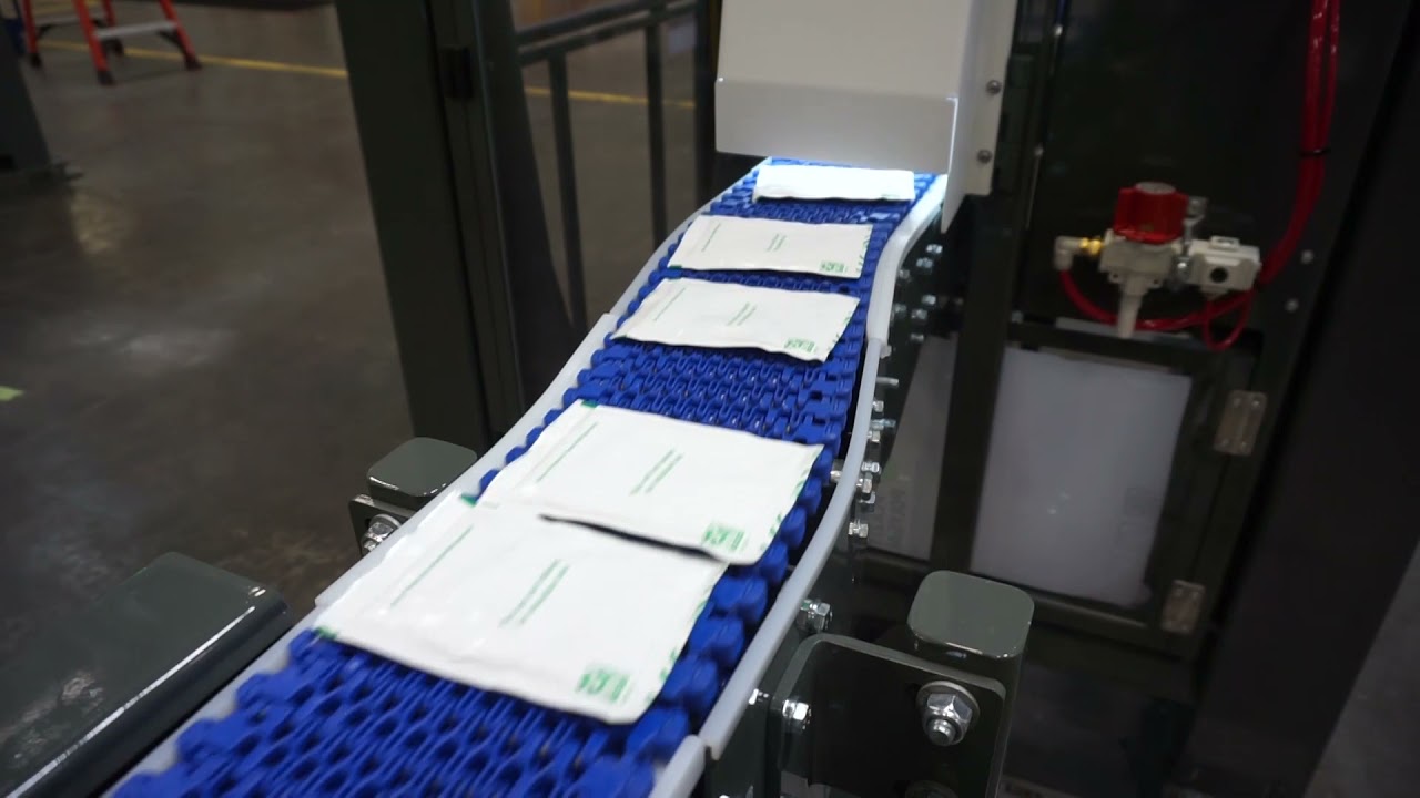 Robotic Material Handling Stacker to Cartoner Infeed - Sachets of ...