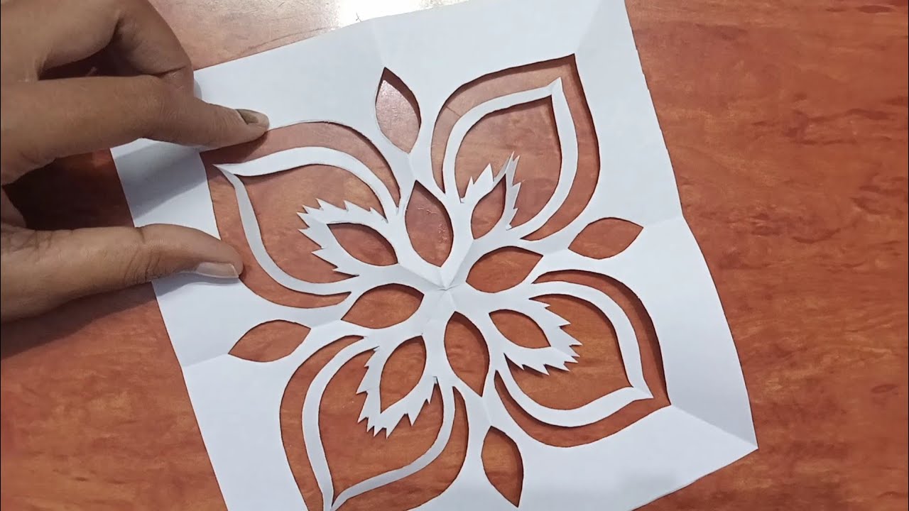 Rangoli paper design। Rangoli paper cutting। paper stencil design - YouTube