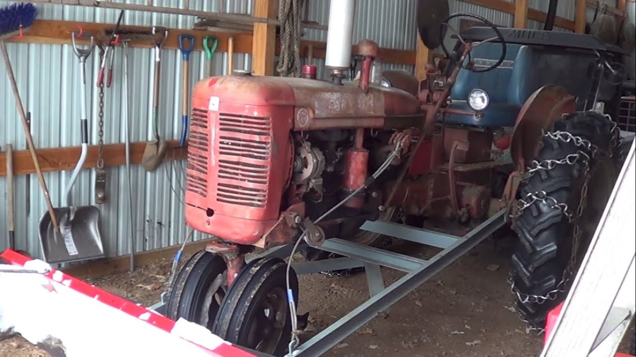Farmall Super C gets new tire chains for plowing snow. - YouTube