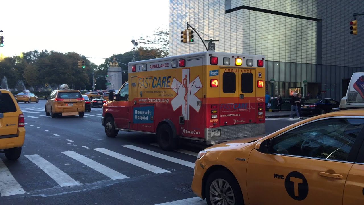 FAST CARE EMS AMBULANCE RESPONDING ON 8TH AVENUE IN THE MIDTOWN AREA OF ...