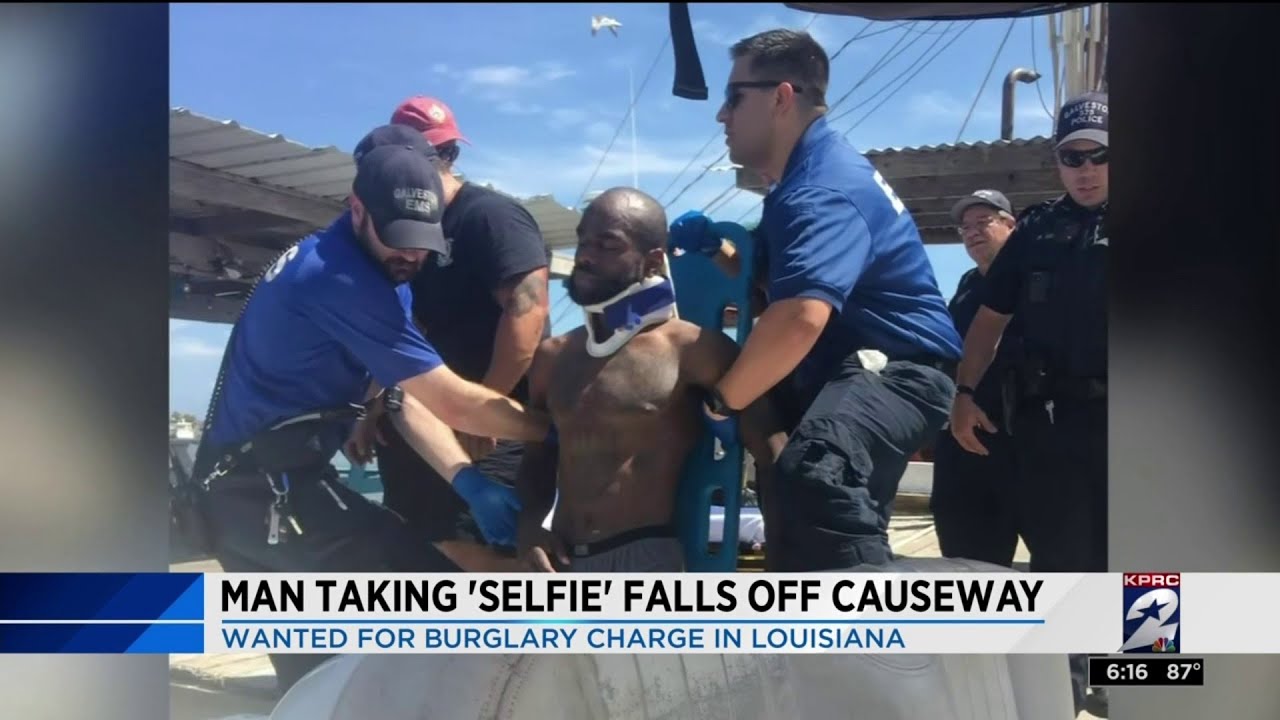 Man taking 'selfie' falls off causeway - YouTube
