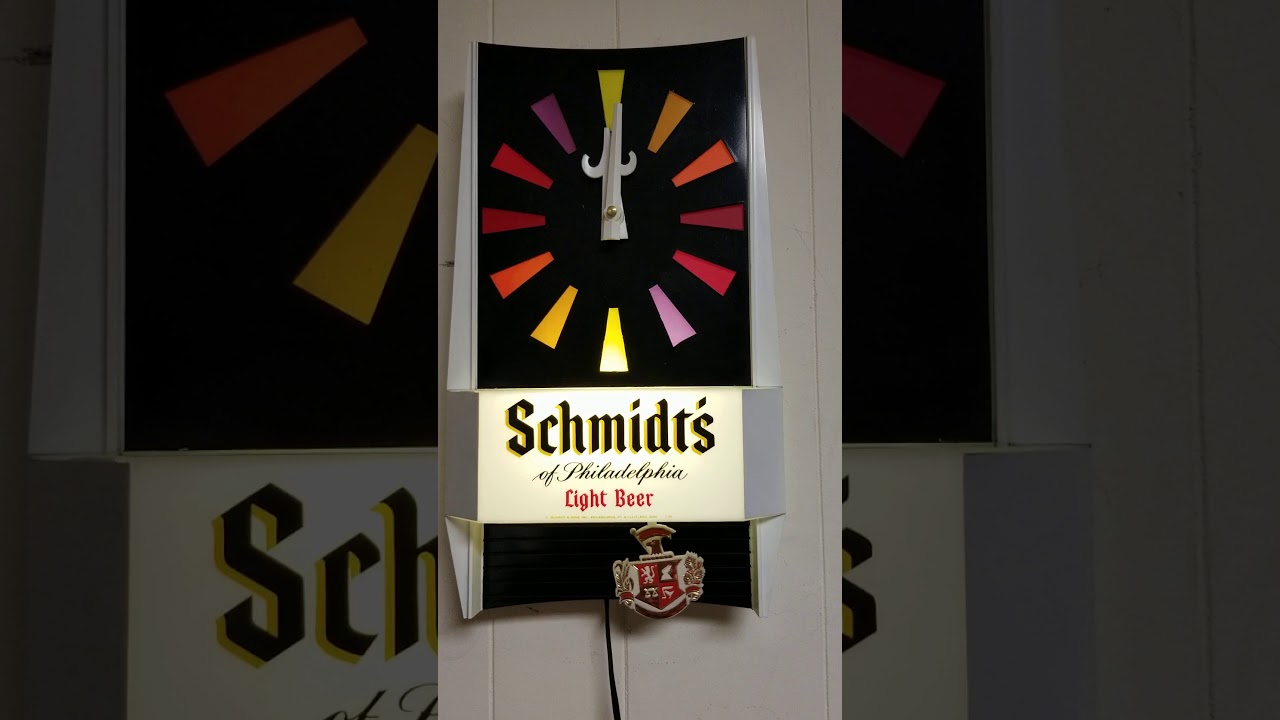 Schmidt's beer sign motion pendulum lighted wall clock - YouTube