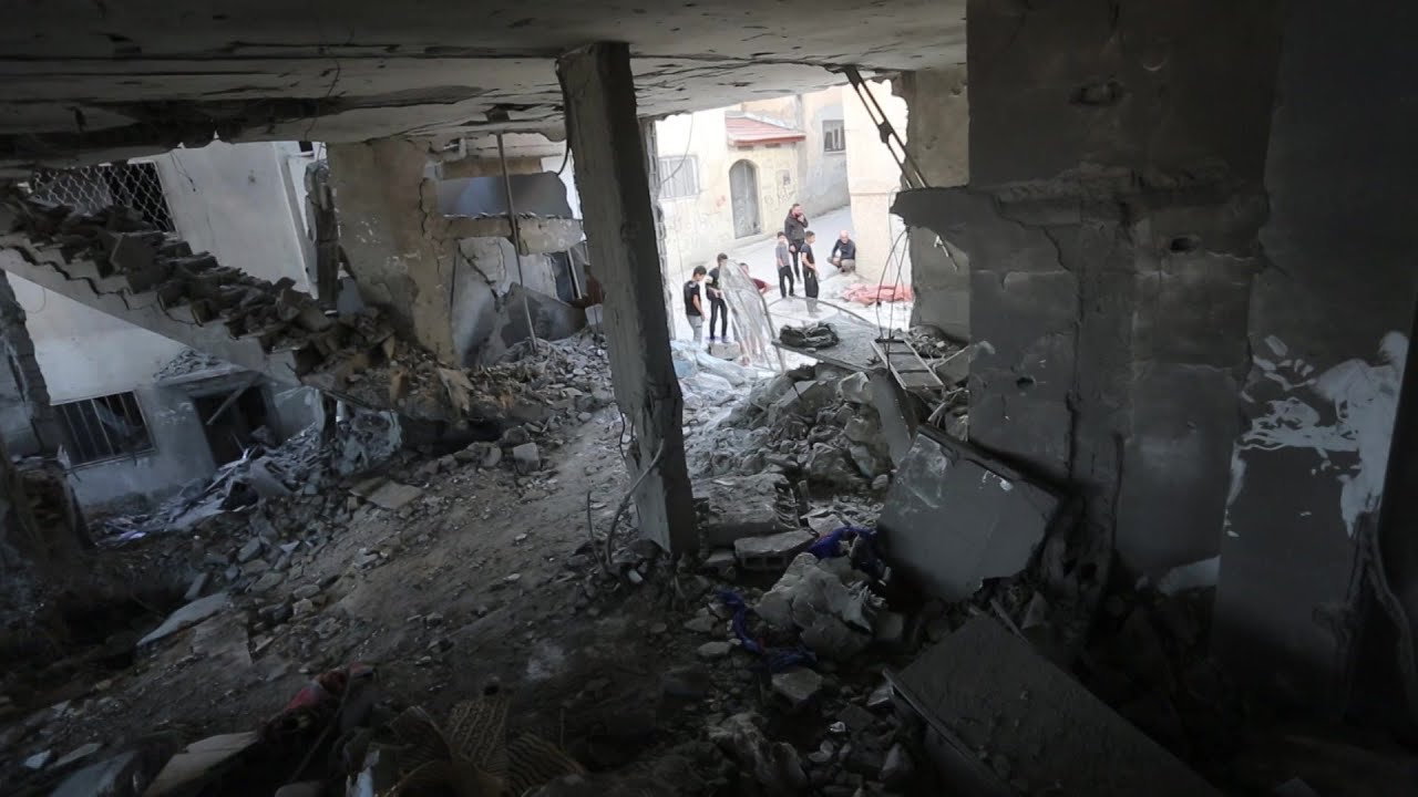 Palestinians inspect rubble after Jenin mosque air strike | AFP - YouTube