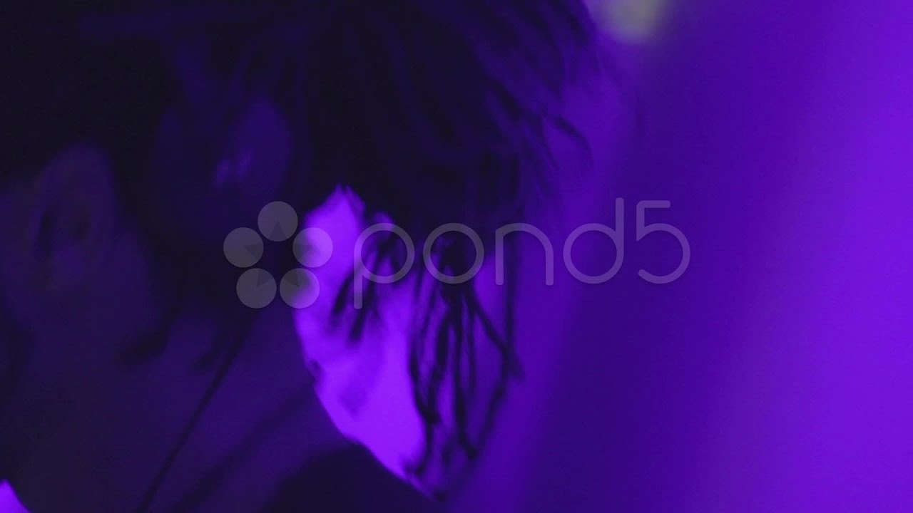 Funny hair dreads of dj in nightclub moving in the rhythm of music ...