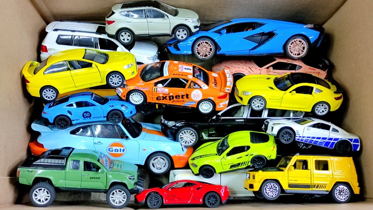 Box full of various cars model Rolls Royce, Peugeot, DHL, Jaguar ...