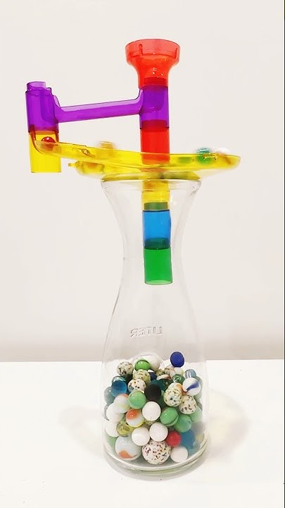 Marbles Spin and Drop into Glass Jar and Nice Sound Tink Tink Tink Tink ...