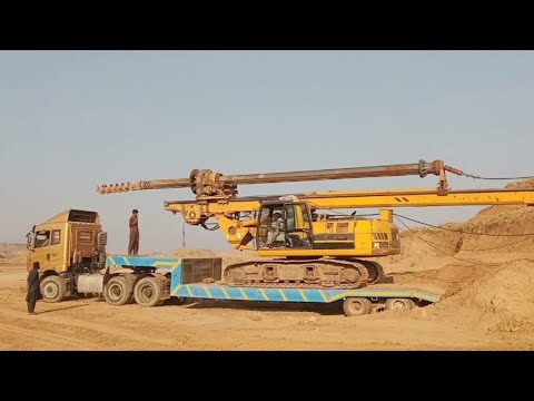 Loading of big augar rig boring machine ||Eearth auger machine tractor ...