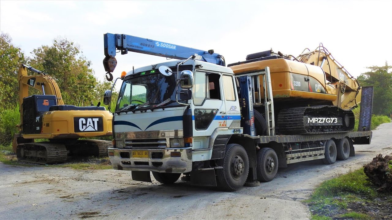 Excavator CAT320D Transported By Fuso Self Loader Truck - YouTube