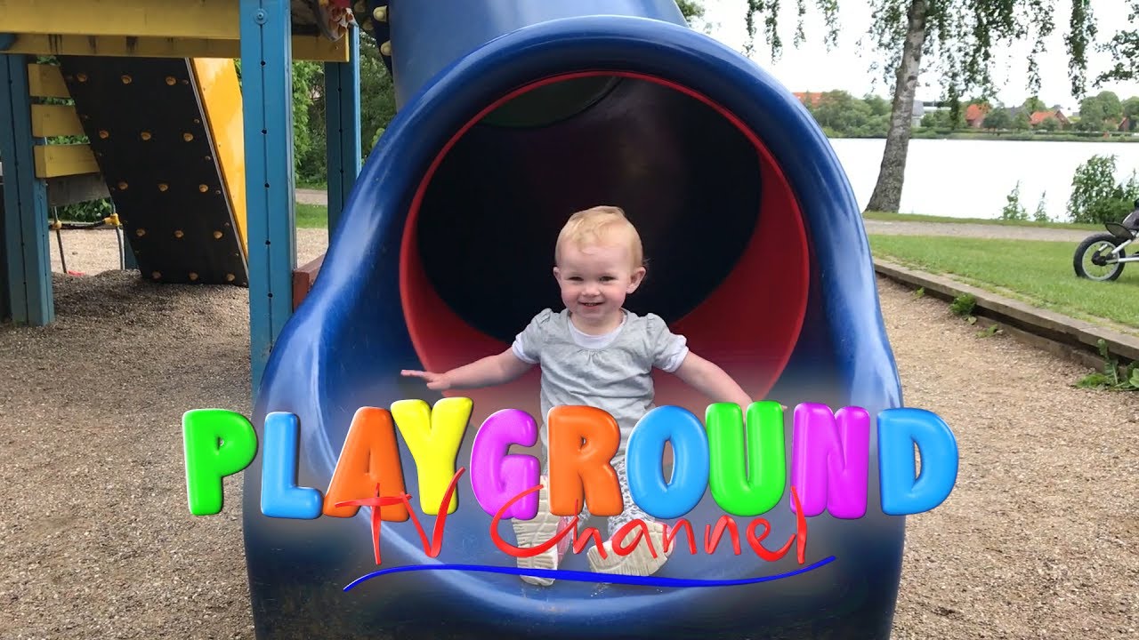 Playground in Denmark with tube slide by the lake - YouTube