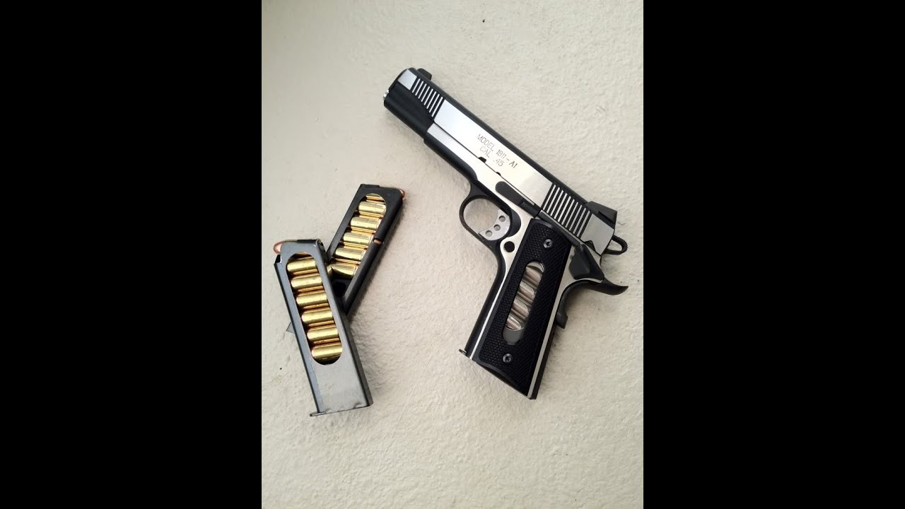 1911 with clear see-through grips and magazines - YouTube