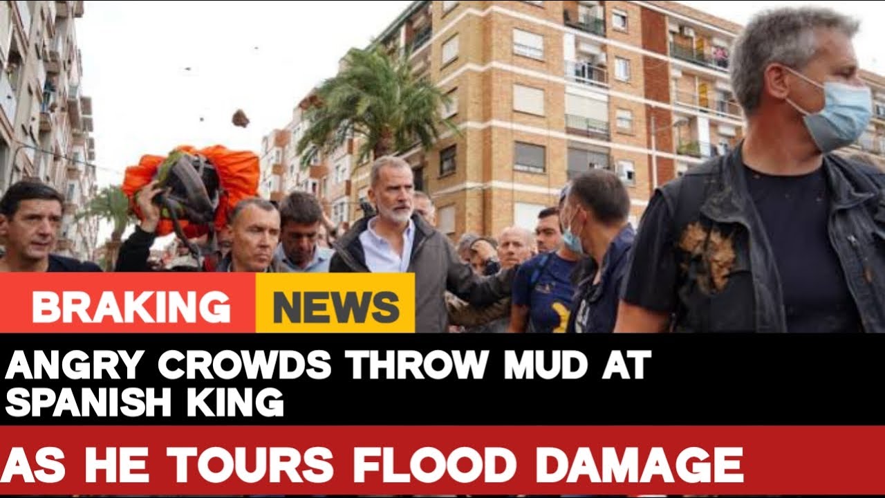 Angry crowds throw mud at Spanish king as he tours flood damage - YouTube