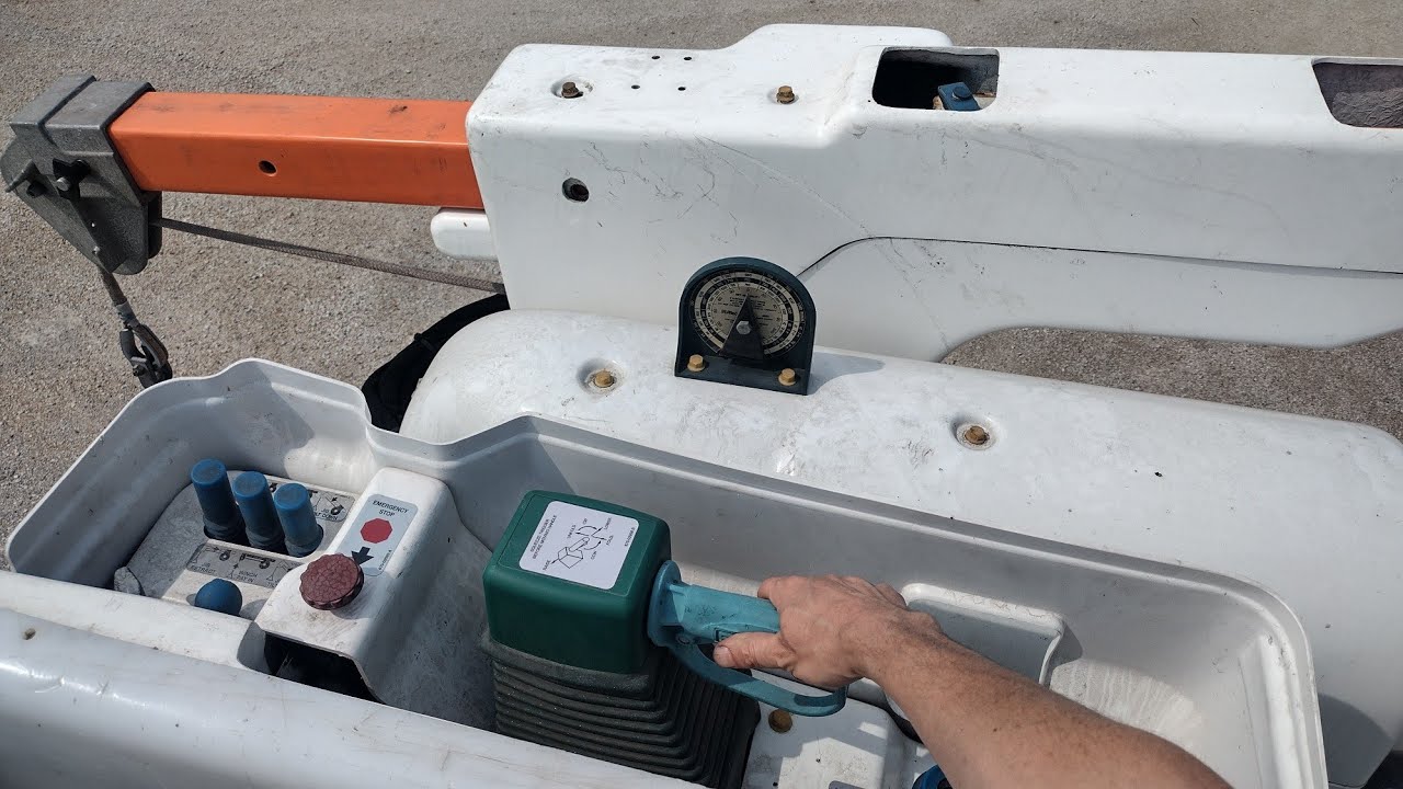 Operating from the upper controls of an Altec bucket truck ...