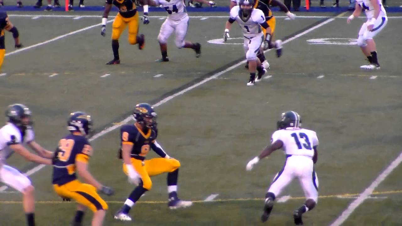 Walled Lake Central's Nick Hudspeth tackles Kettering RB Danotiss Smith ...