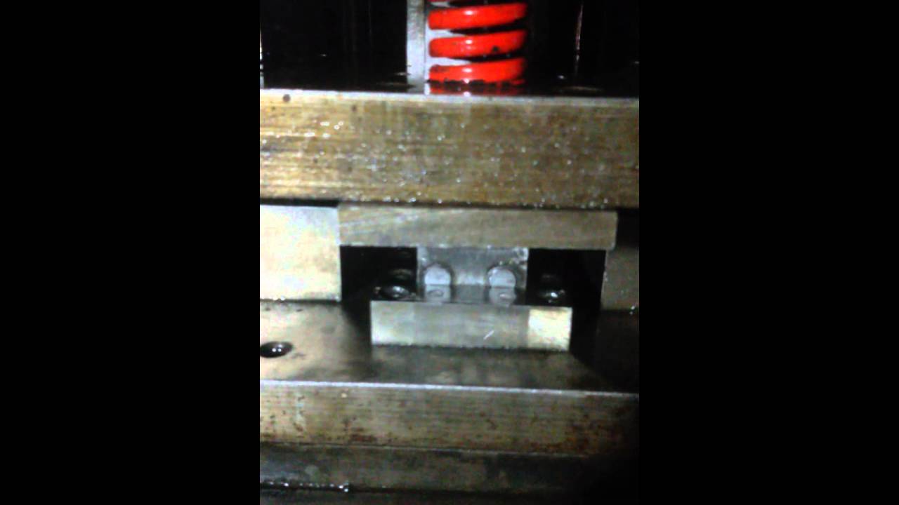 Progressive sheet metal die - YouTube